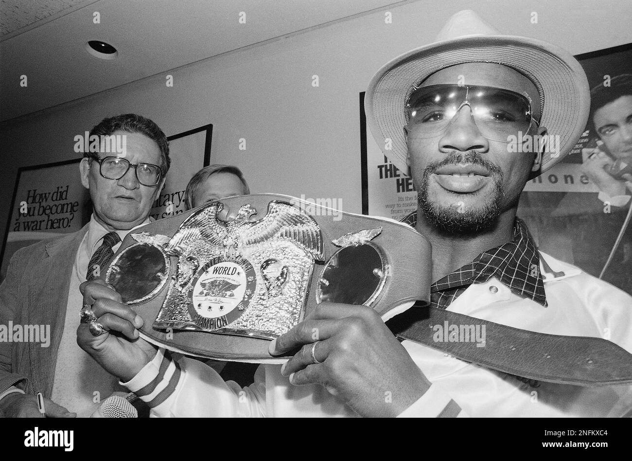 Marvin Hagler, of Brockton, Mass., displays his championship belt as he ...