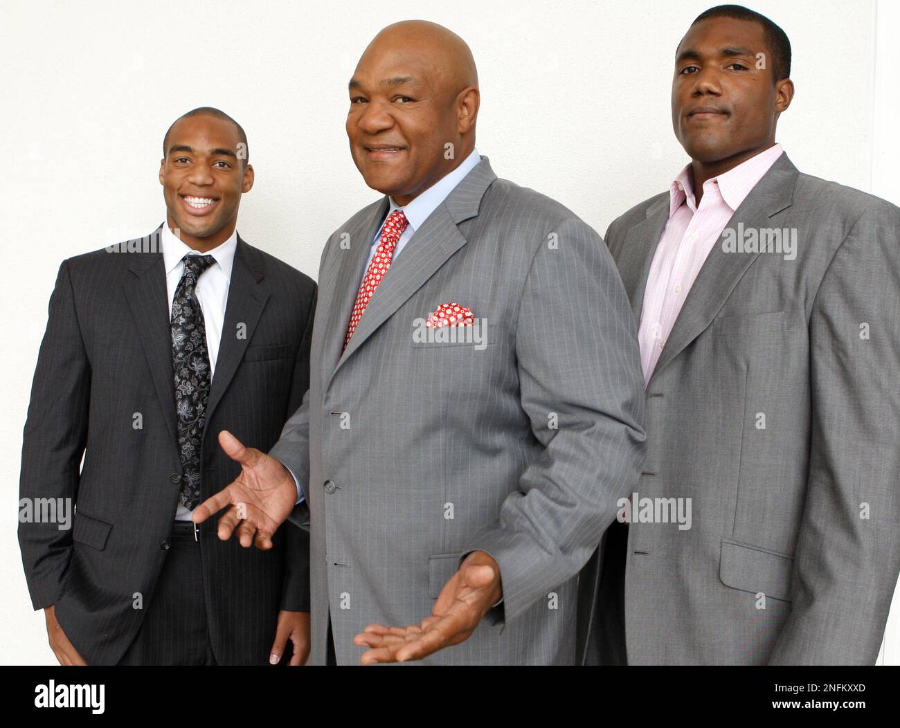 Former heavyweight champion George Foreman Sr., center, and his sons ...