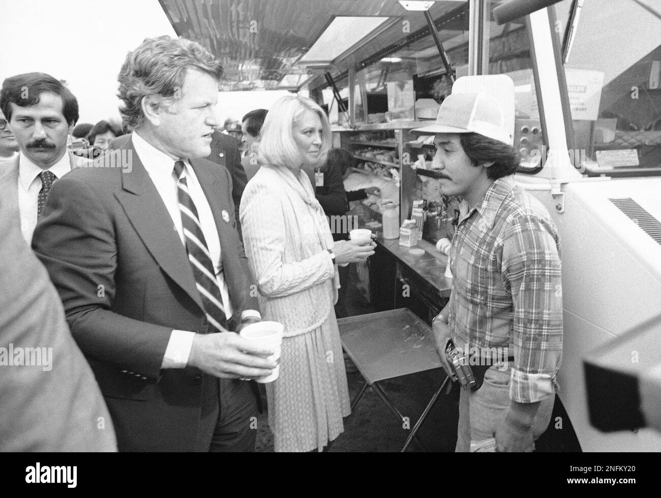 Sen. Edward M. Kennedy and his wife Joan stop to chat with Don Tenorio ...