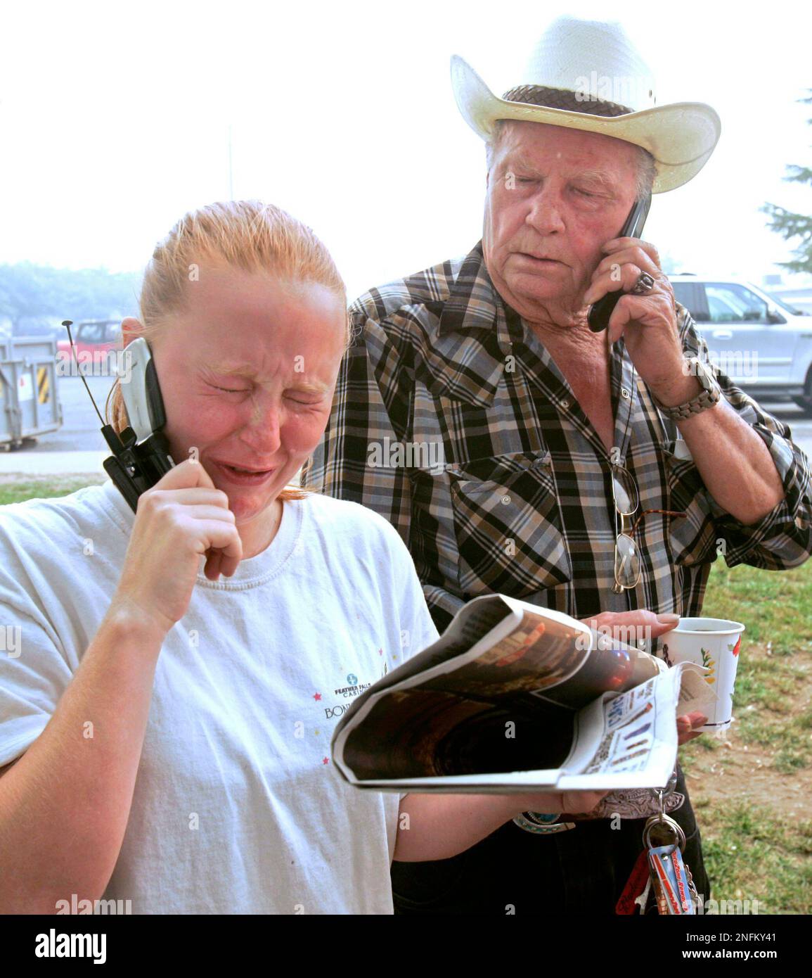 Mary Johnston breaks into tears as she and her father, Boyd Johnston ...