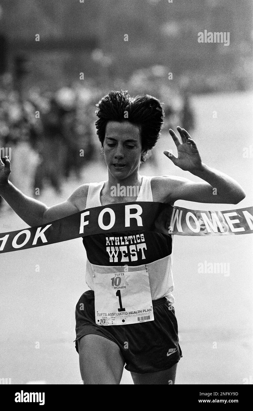 Marathon runner Joan Benoit Samuelson reacts as she breaks the tape at ...
