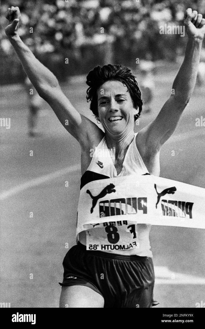 Marathon runner Joan Benoit reacts while crossing the finish line to ...