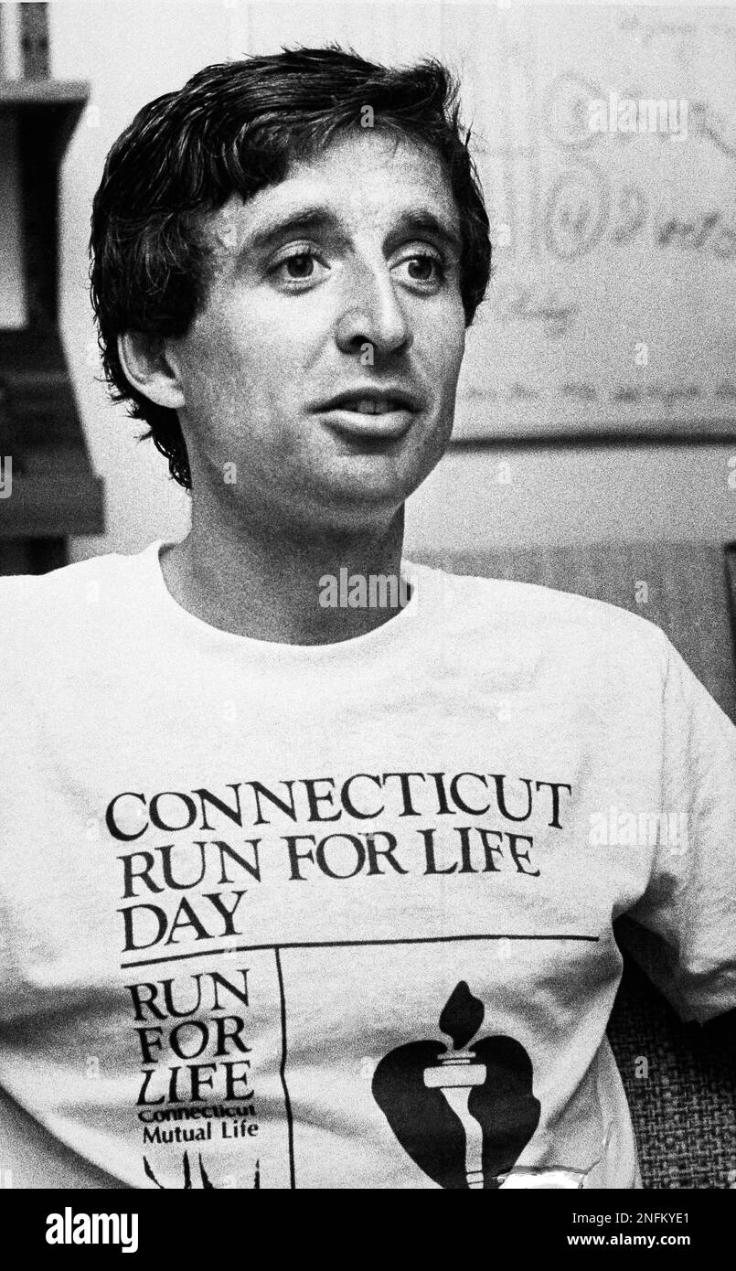 Marathon runner Frank Shorter is shown speaking to reporters in ...