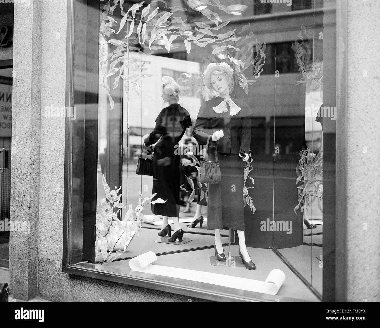 This is a display window of De Pinna's clothing store on Fifth Avenue ...