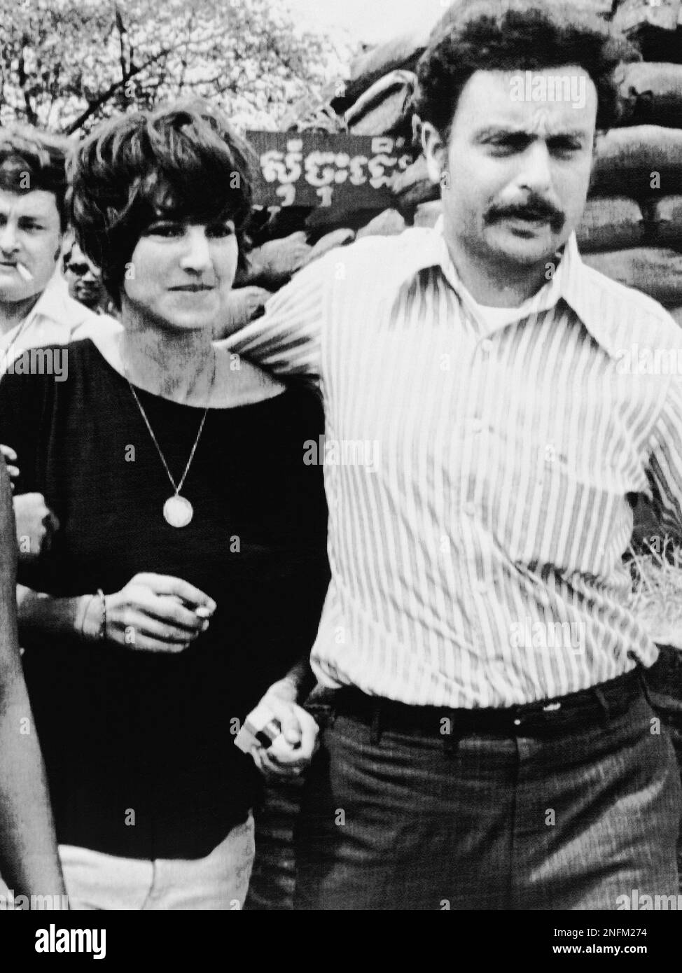 New Zealander Kate Webb, UPI Bureau chief in Cambodia, is led from ...