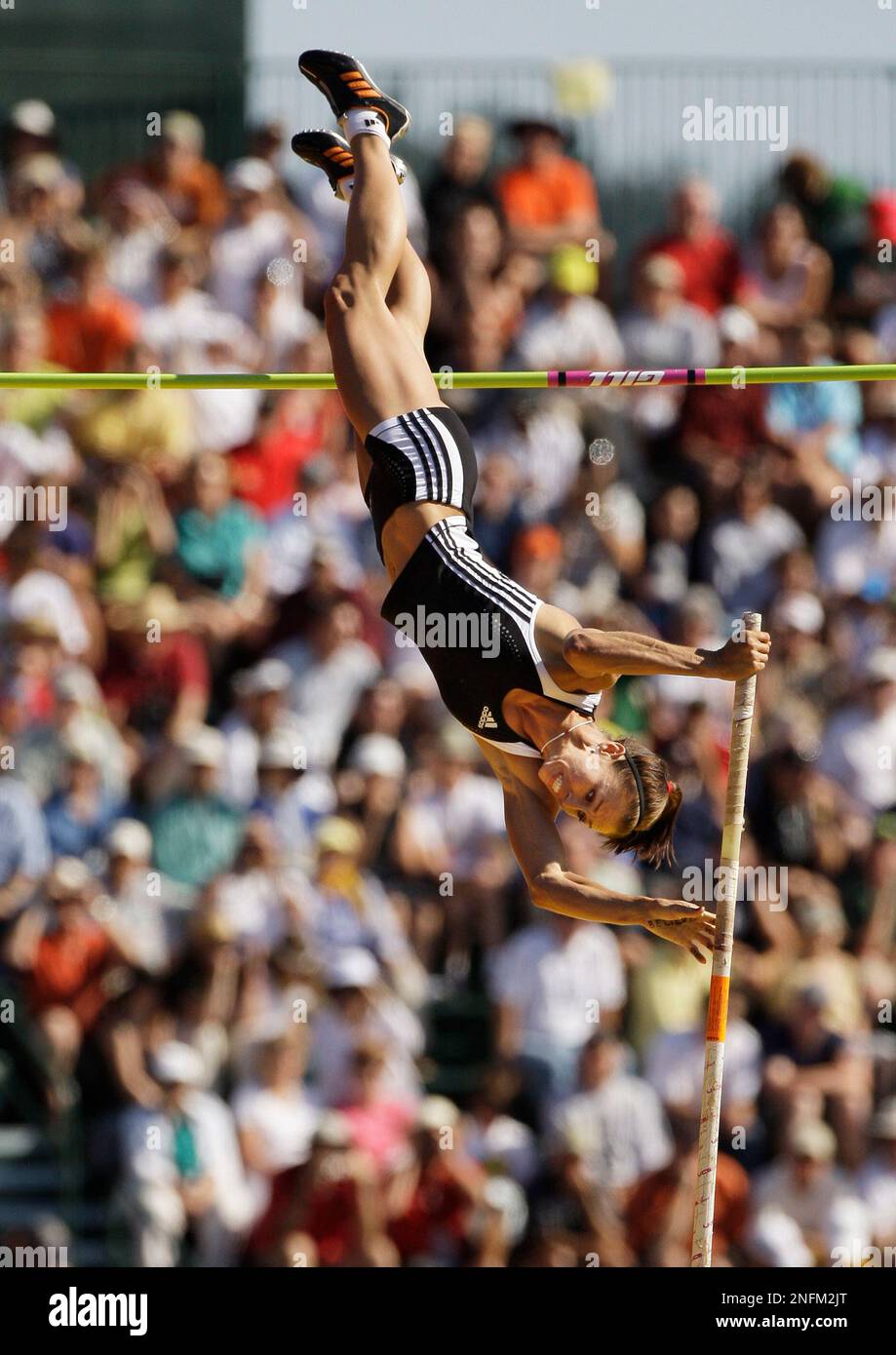 April Steiner launches herself over the bar to win the women's pole ...
