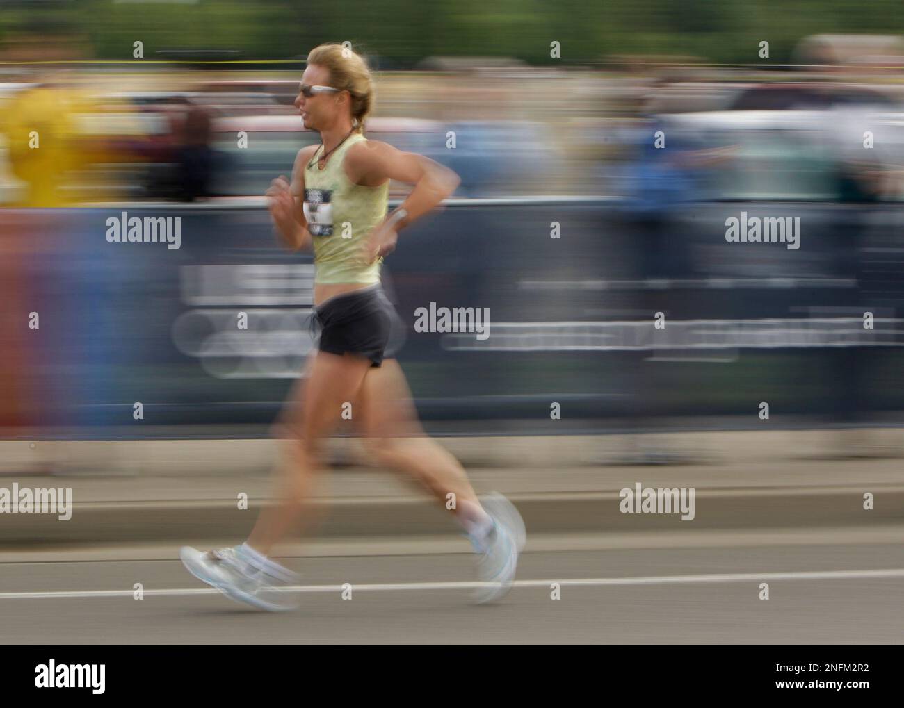 Joanne Dow makes her way past spectators during the women's 20 ...
