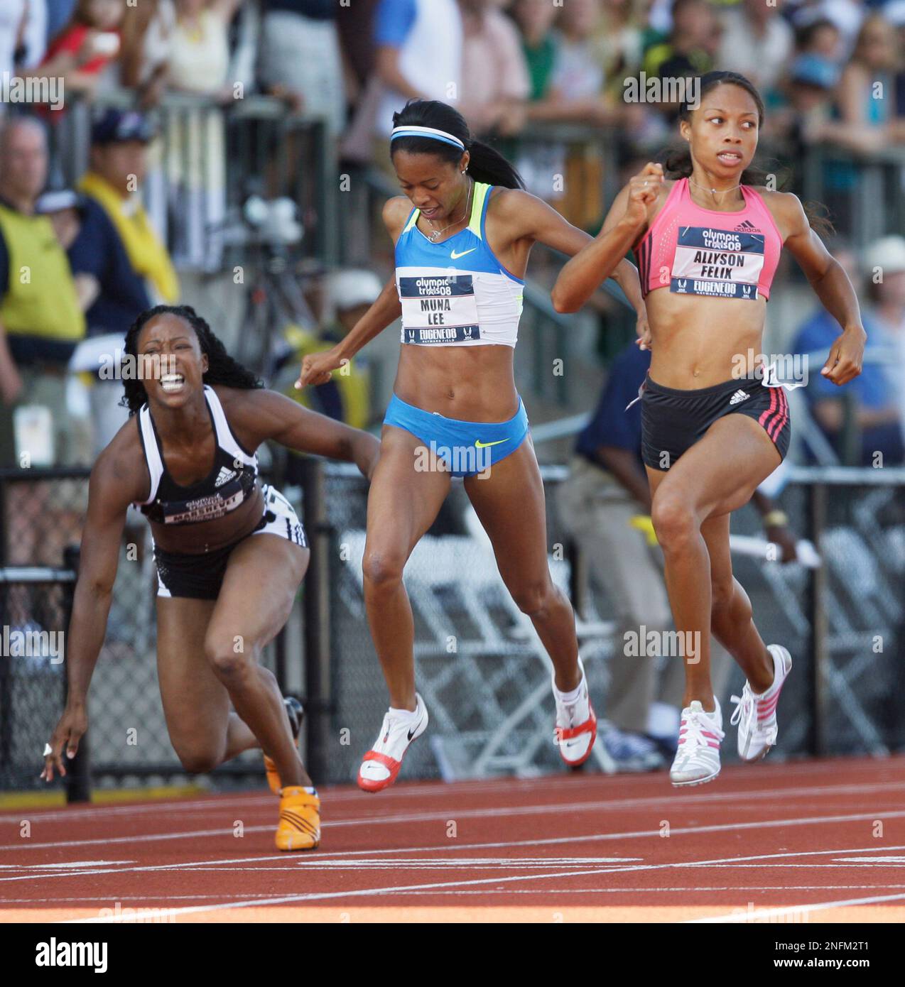 Allyson Felix, right, finishes ahead of Muna Lee and Marshevet Hooker, left, as she falls at the ...