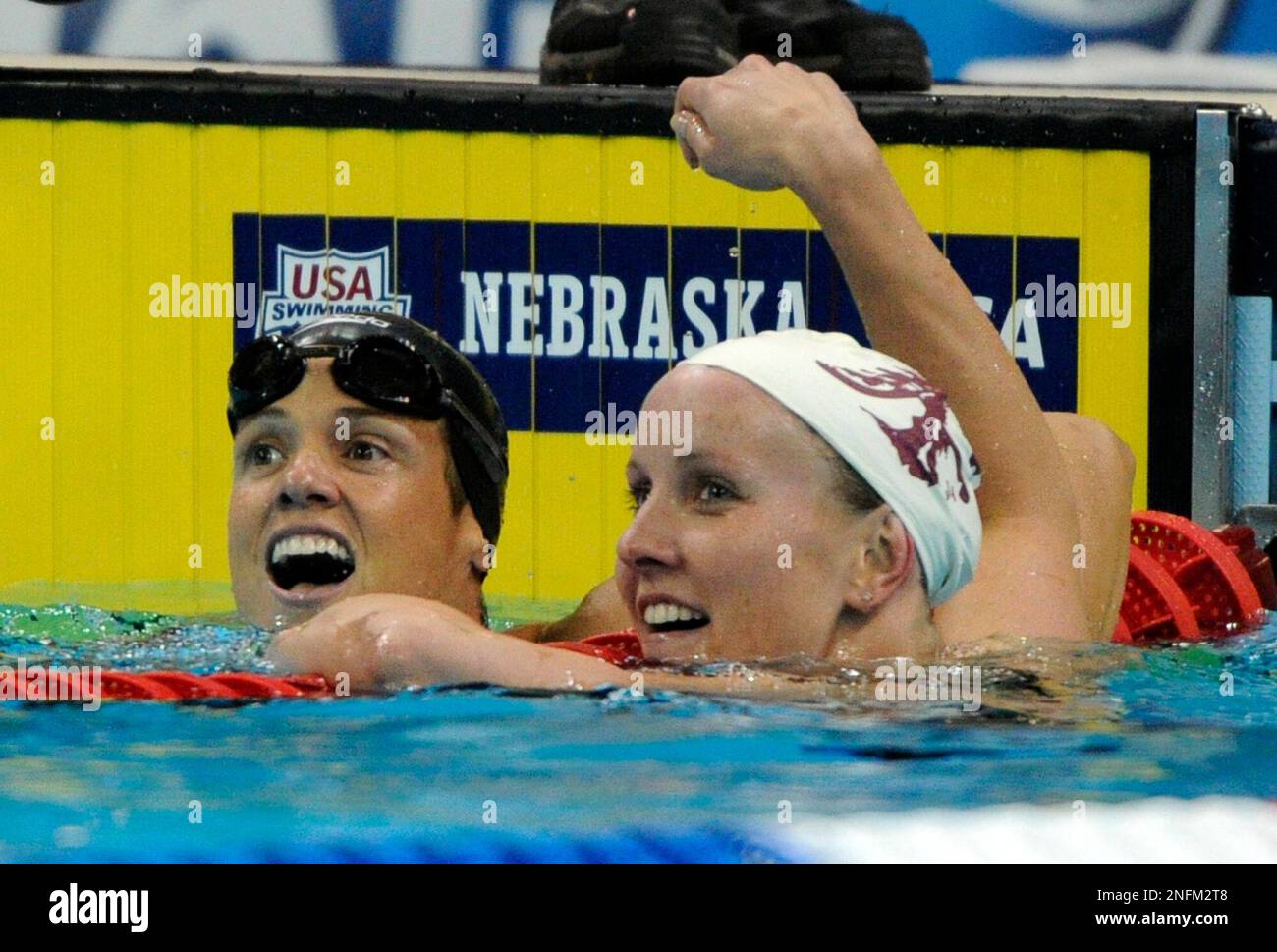 Dara Torres, left, and Jessica Hardy look up at the timing clock after ...