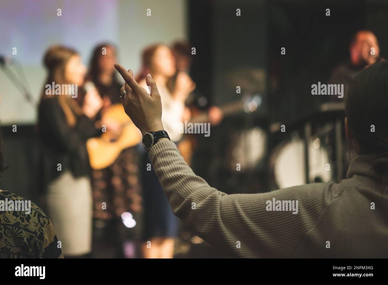 Hands in the air of a woman who praise God at church service Stock ...