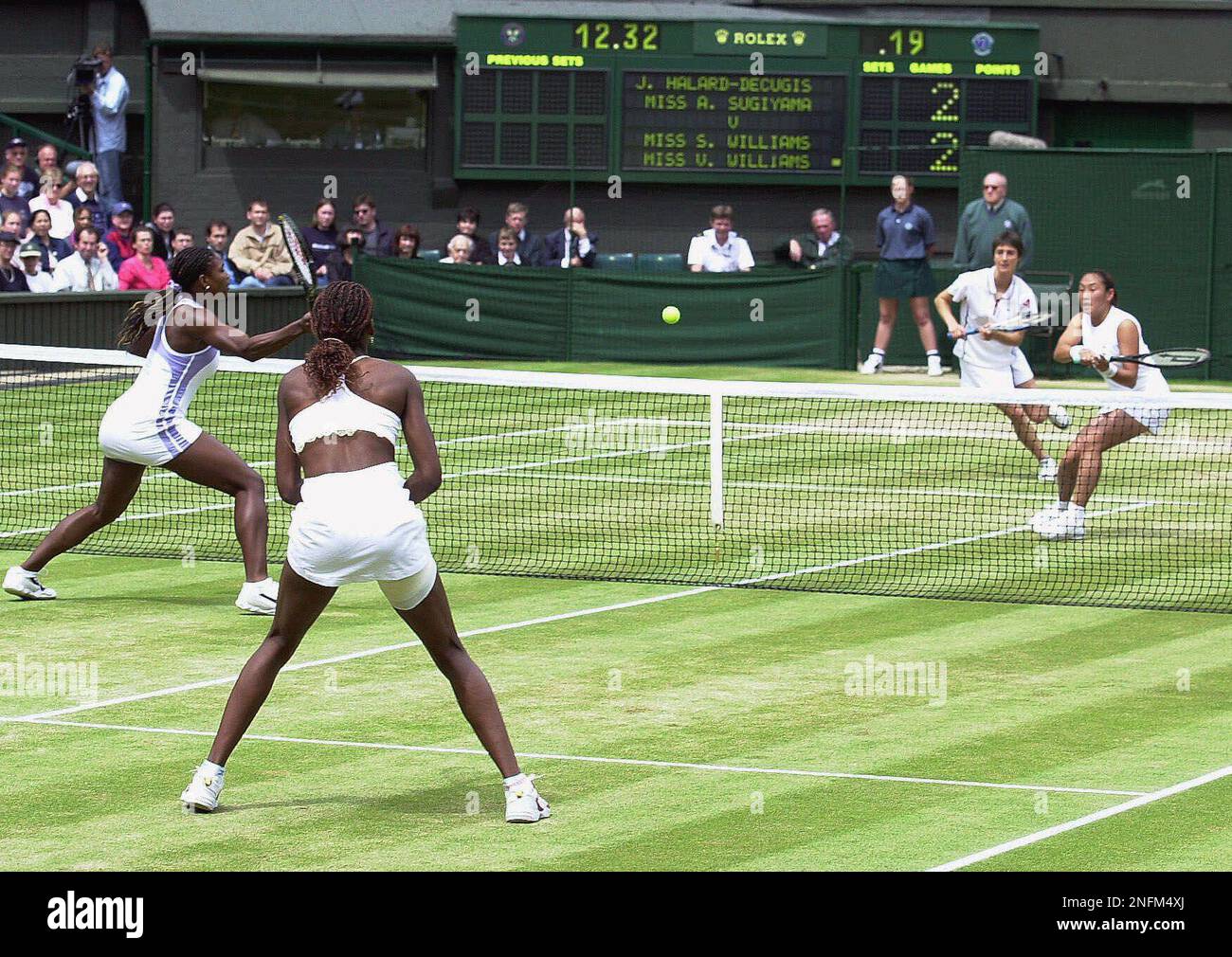 Japan's Ai Sugiyama right, and her partner of France, face Serena, left ...