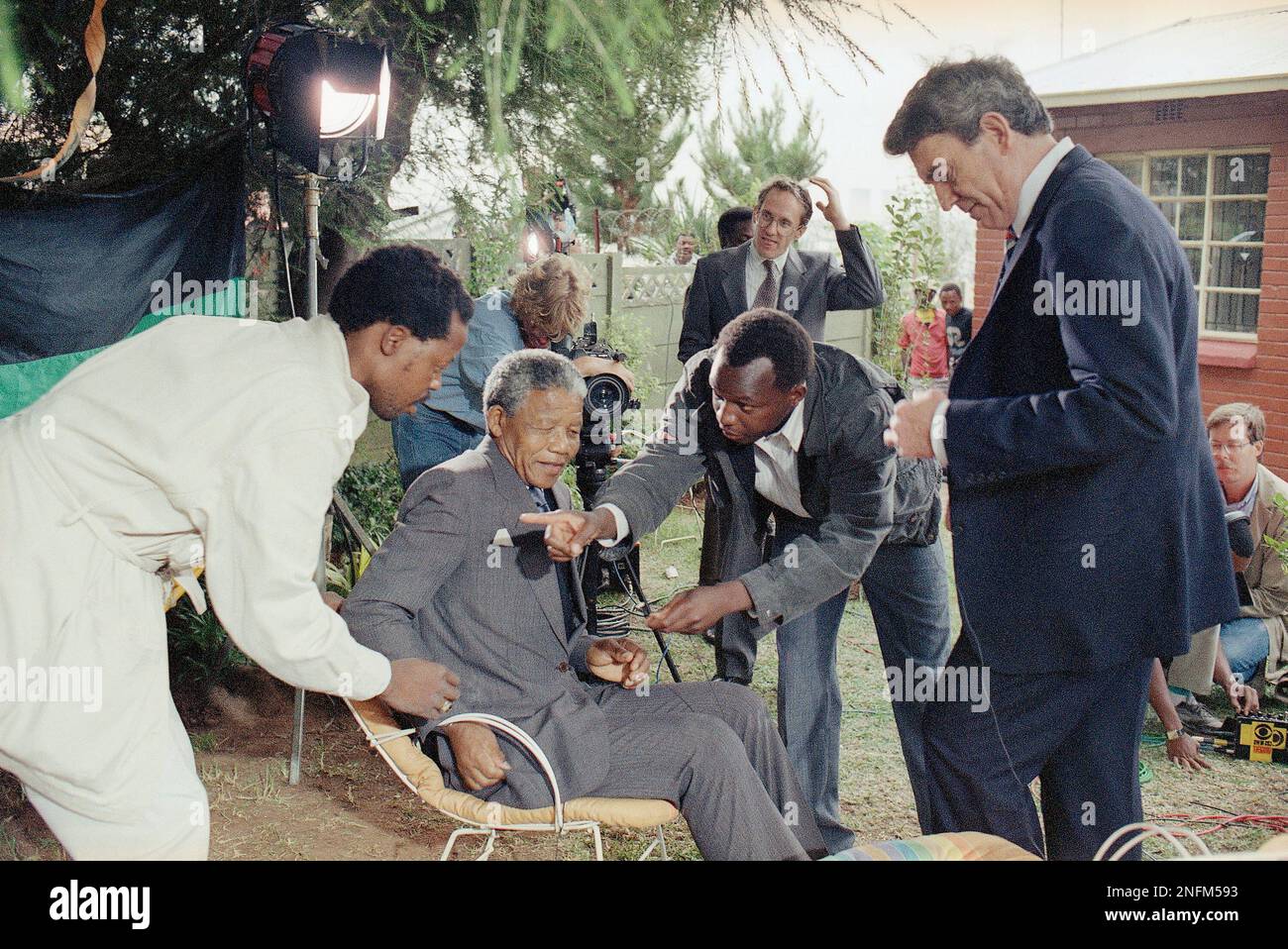 Released ANC leader Nelson Mandela is wired for a television interview ...
