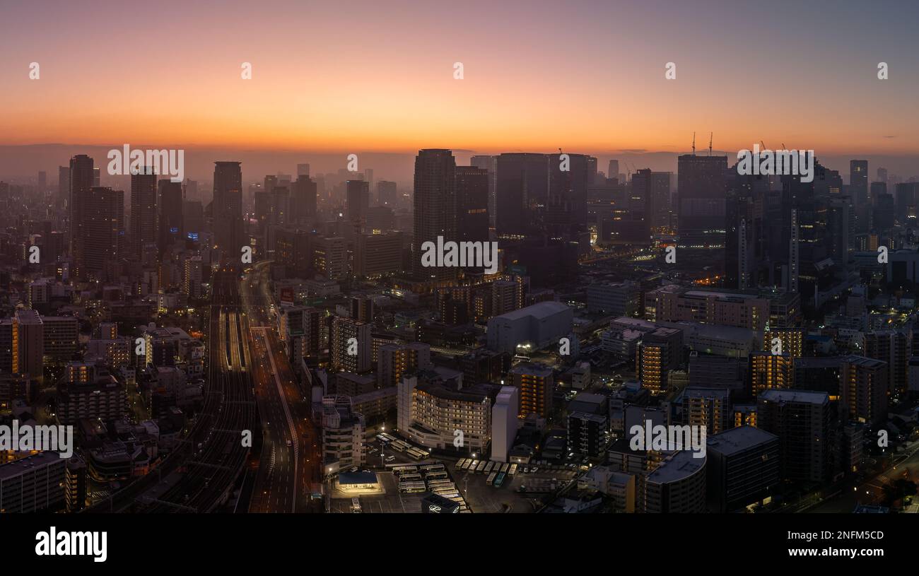 Modern city shrouded in atmospheric haze with first light of day on ...