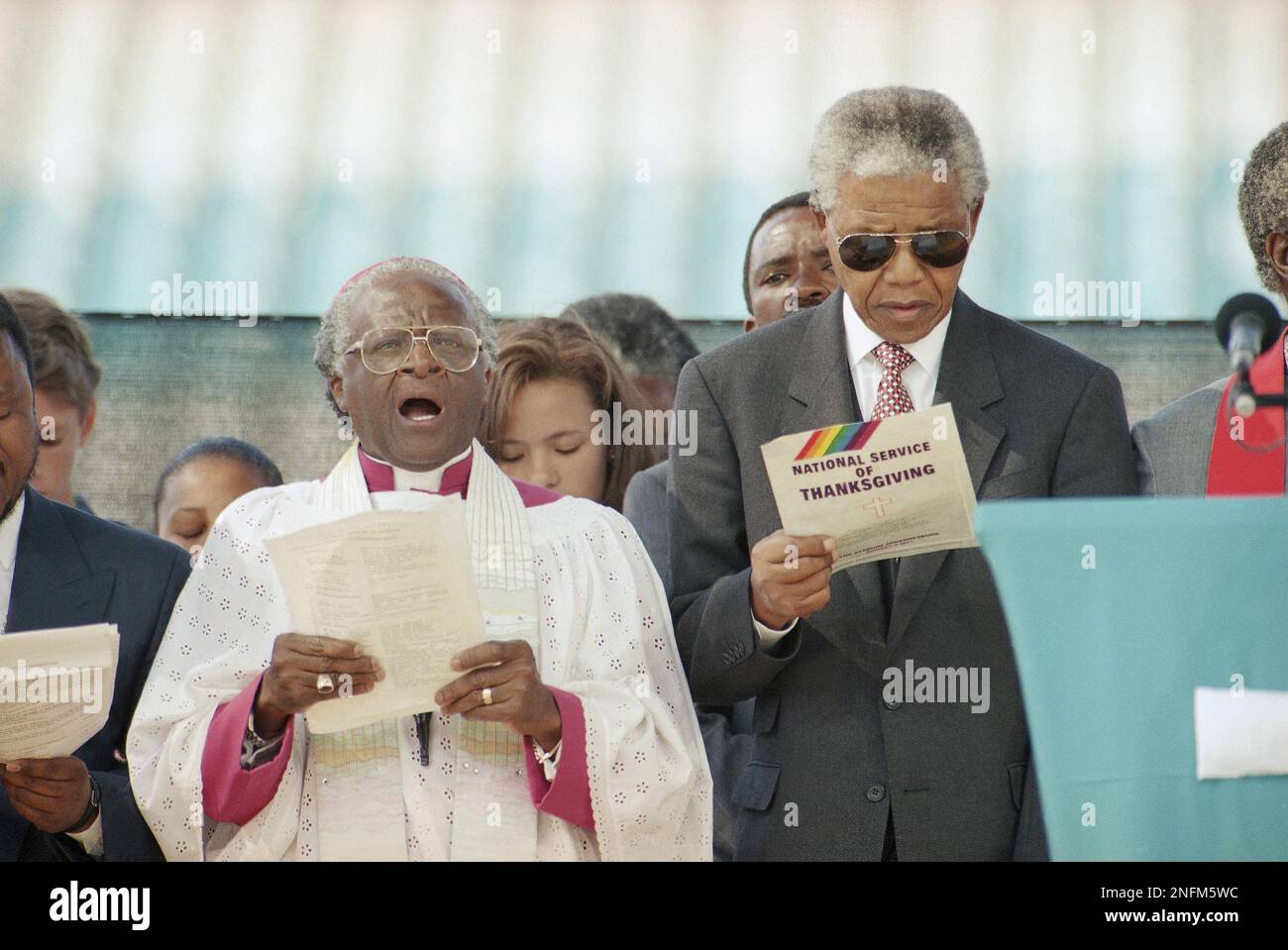 Archbishop Desmond Tutu, left, and President-Elect Nelson Mandela sing ...