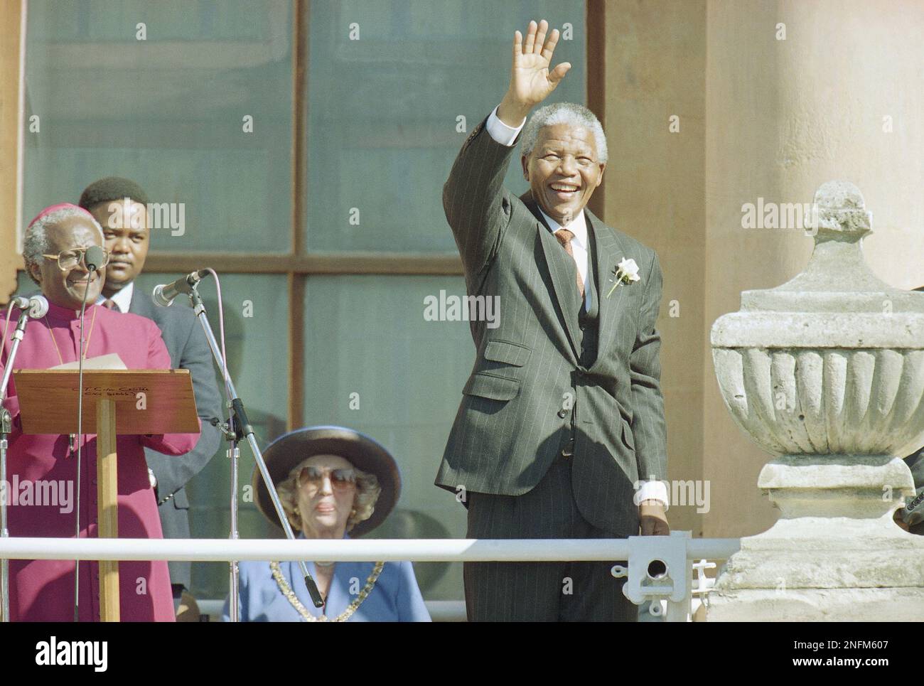 A smiling Nelson Mandela, South Africa's President-elect, waves to the ...