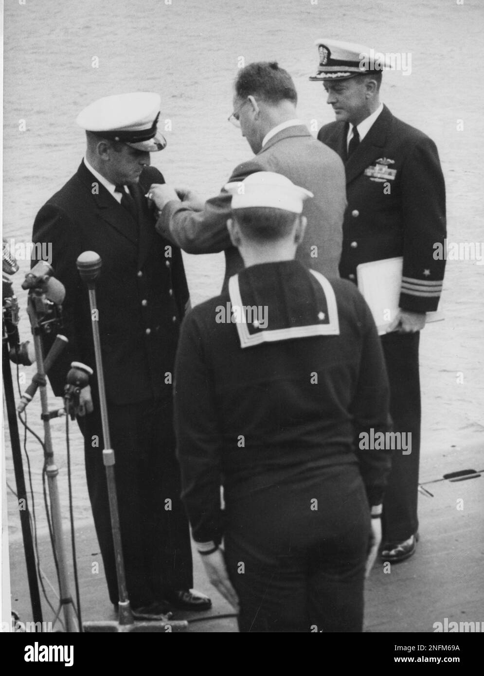 U.S. ambassador John Hay Whitney confers decoration on chief torpedo ...