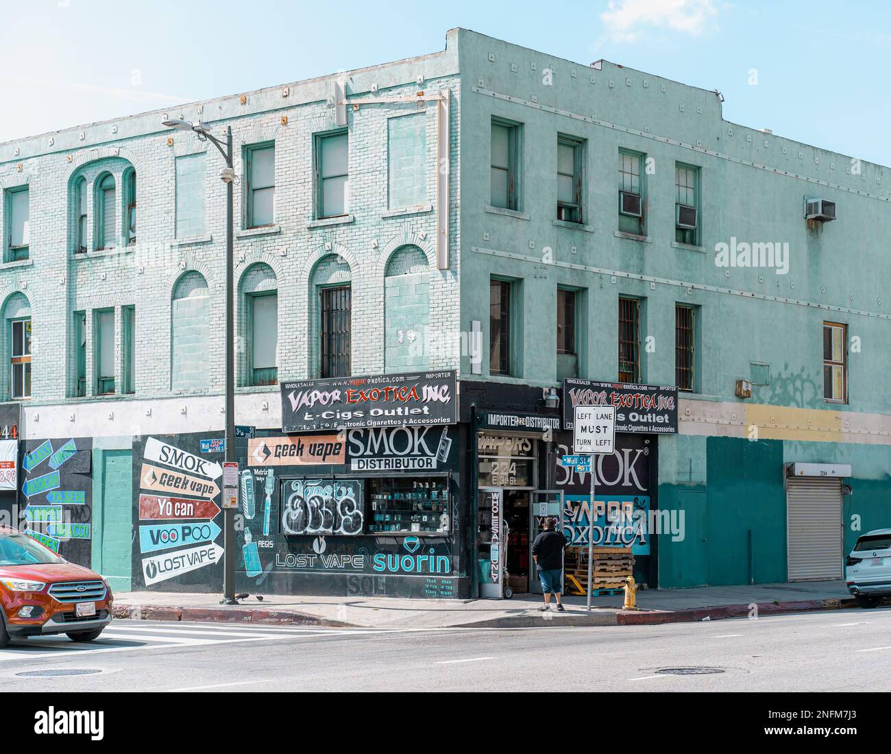An old building with small markets and colorful posters in Los Angeles ...