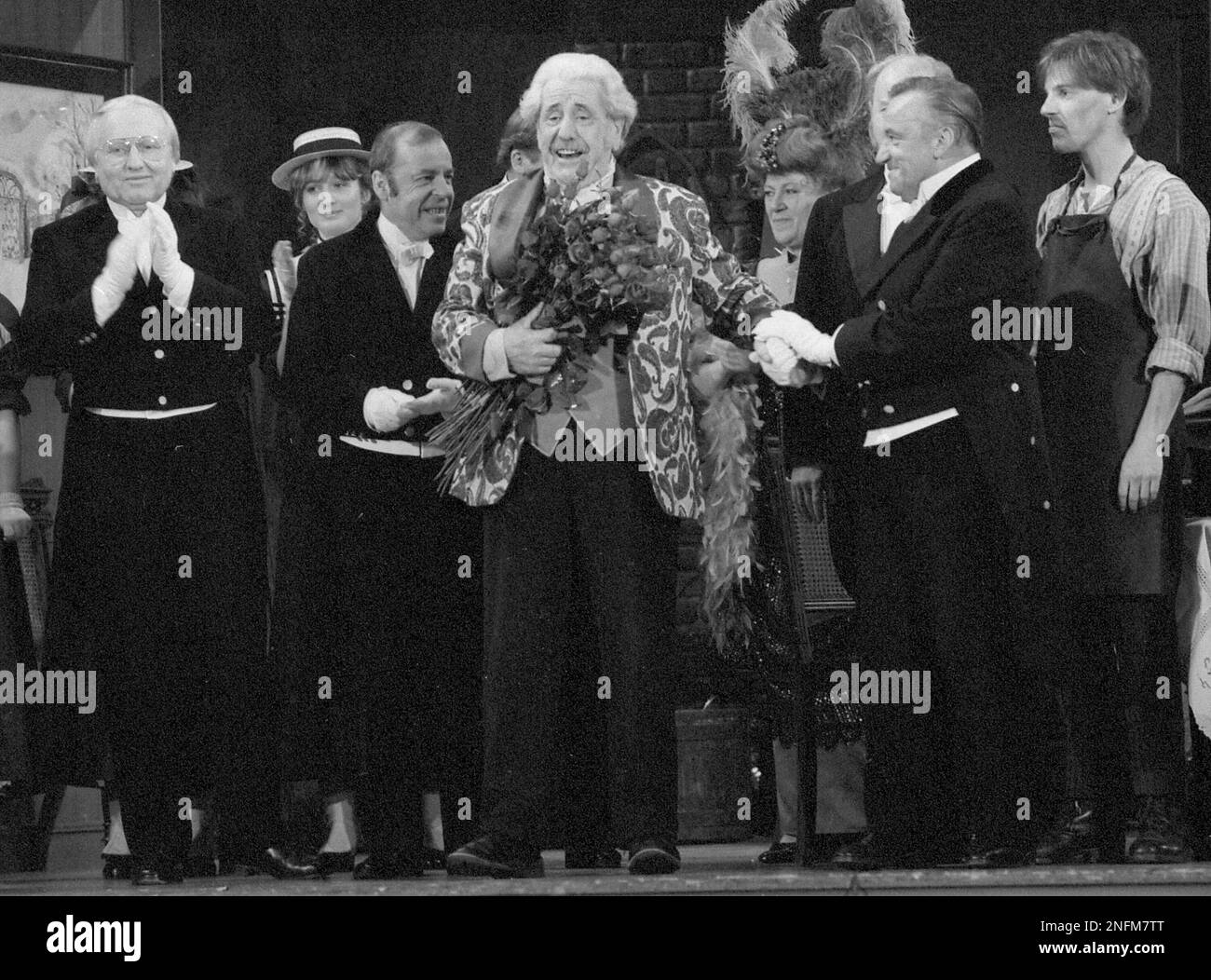 West German actor Willy Millowitsch, center, is all smiles as he holds ...