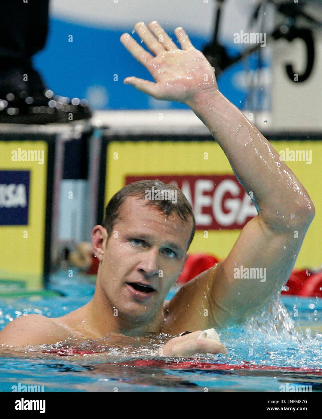 Brendan Hansen waves after winning the men's 100-meter breaststroke ...