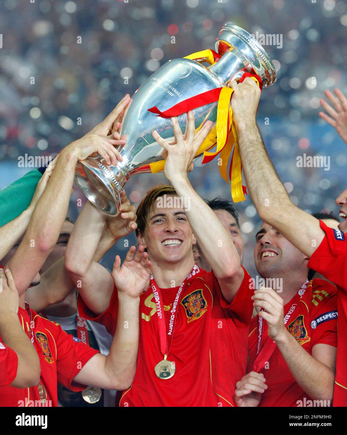 Spain's Fernando Torres celebrates with the trophy after winning the ...
