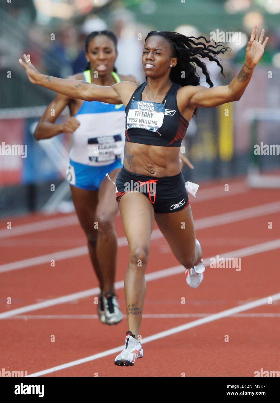 Tiffany Ross-Williams crosses the finish line to win the women's 400 ...