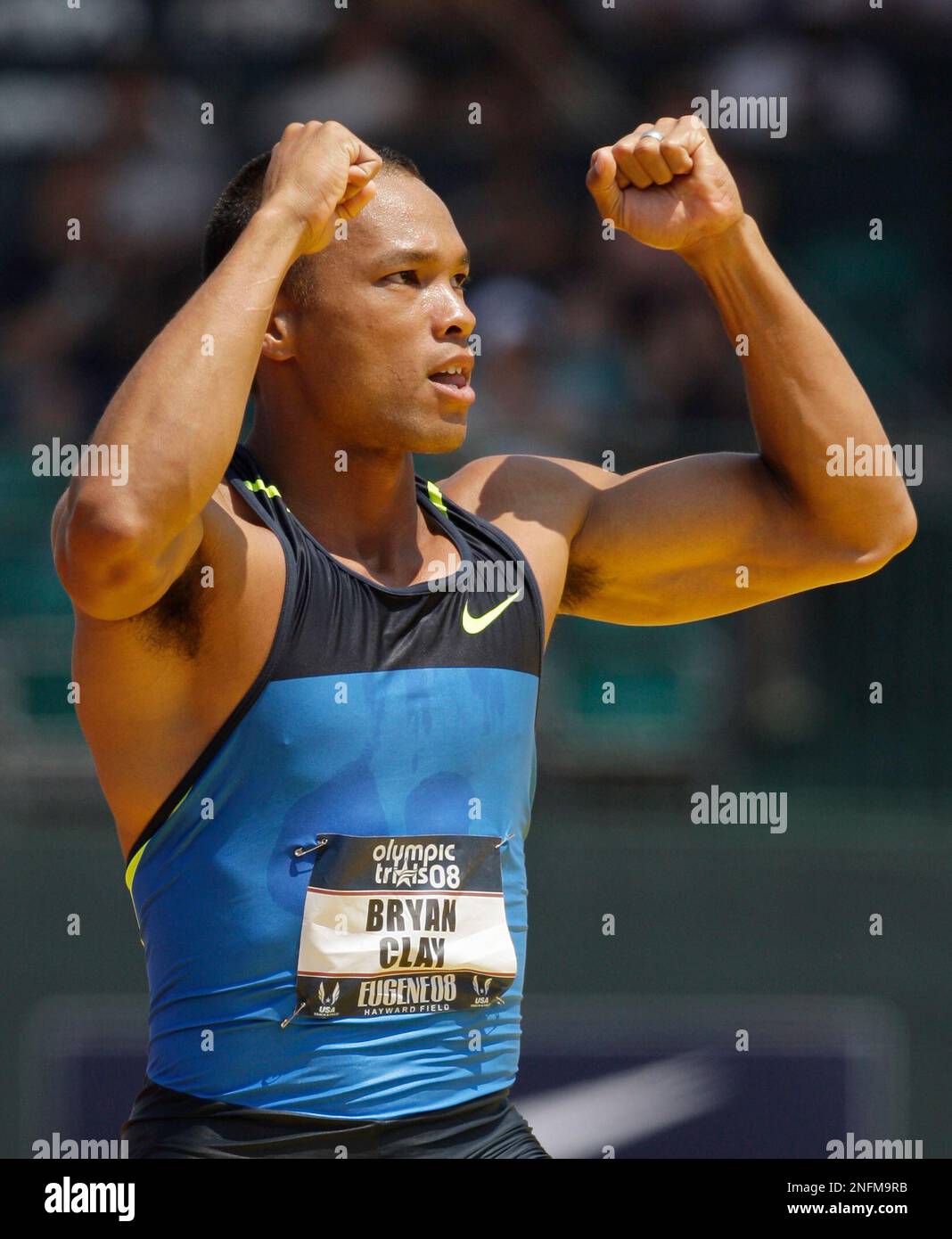 Bryan Clay reacts after clearing the bar in the decathlon high jump ...