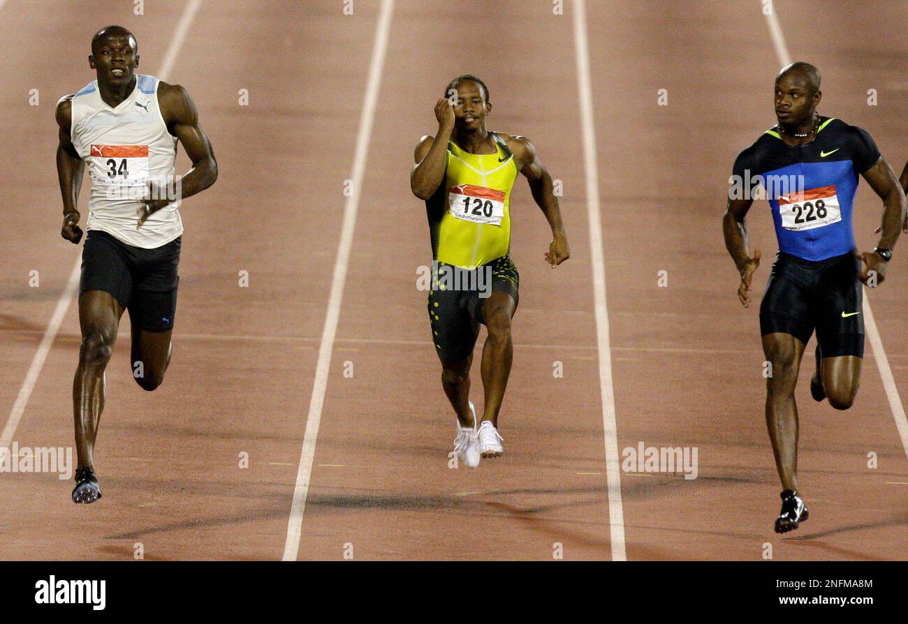 World record holder Usain Bolt, left, wins the 100 meters final, in ...