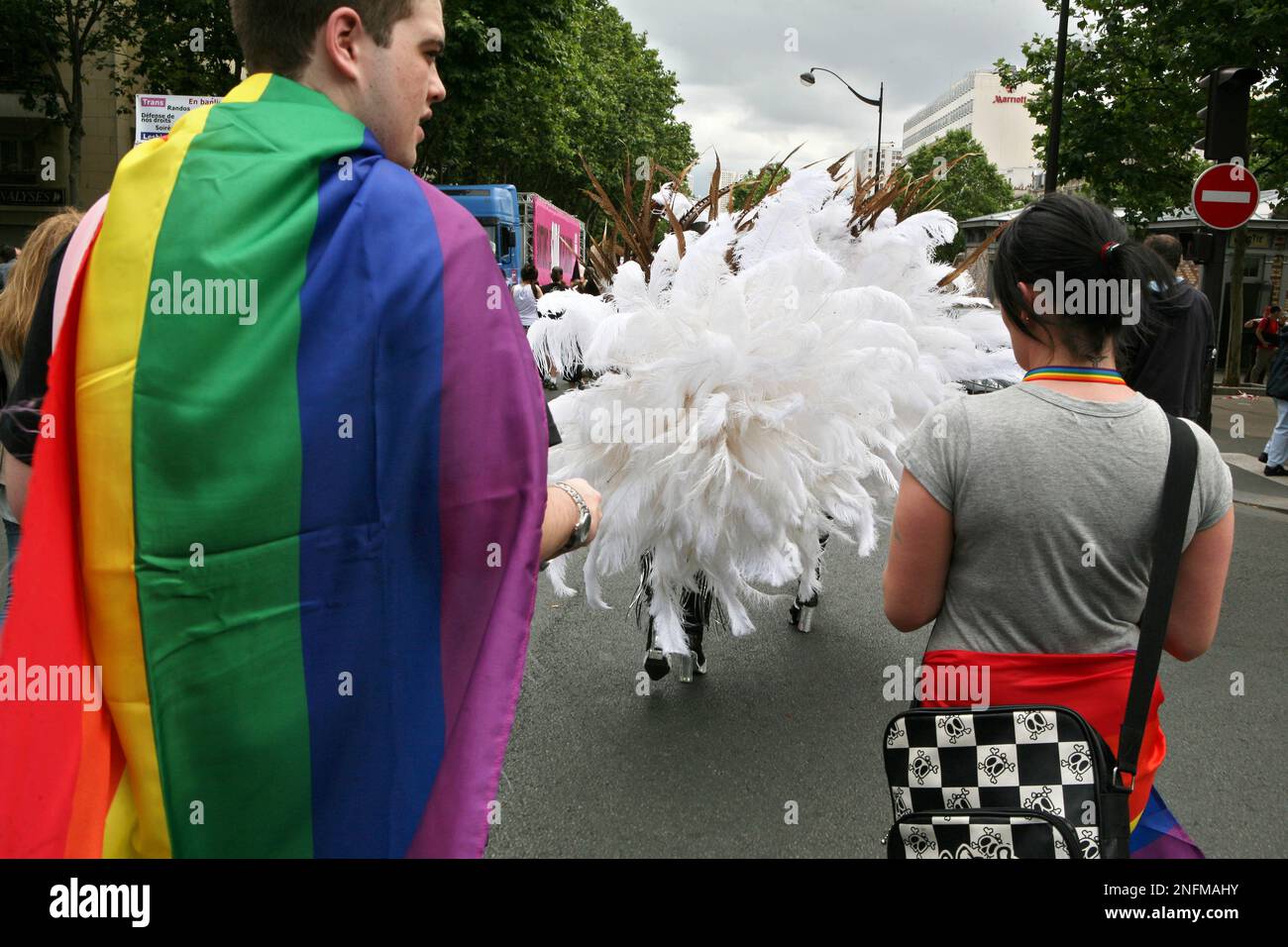 a demonstrator wrapped in a rainbow flag, the symbol of the gay ...