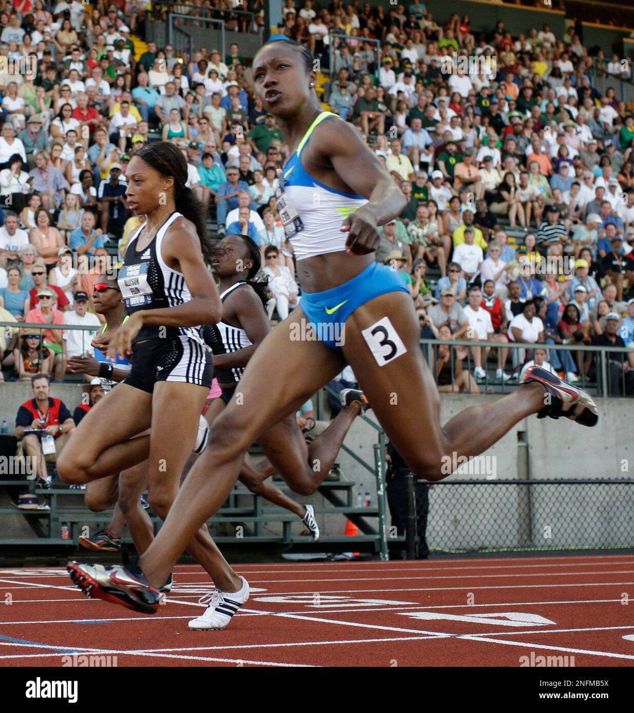 Carmelita Jeter, right, crosses the finish line ahead of Allyson Felix ...