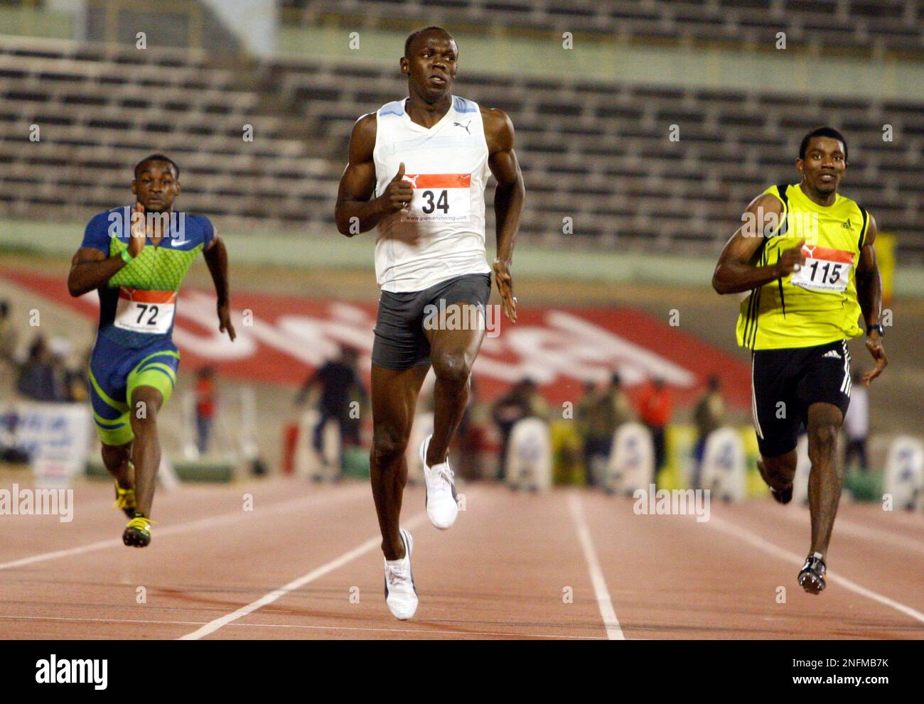 Usain Bolt, center, wins his heat of the 100 meters sprint during the ...