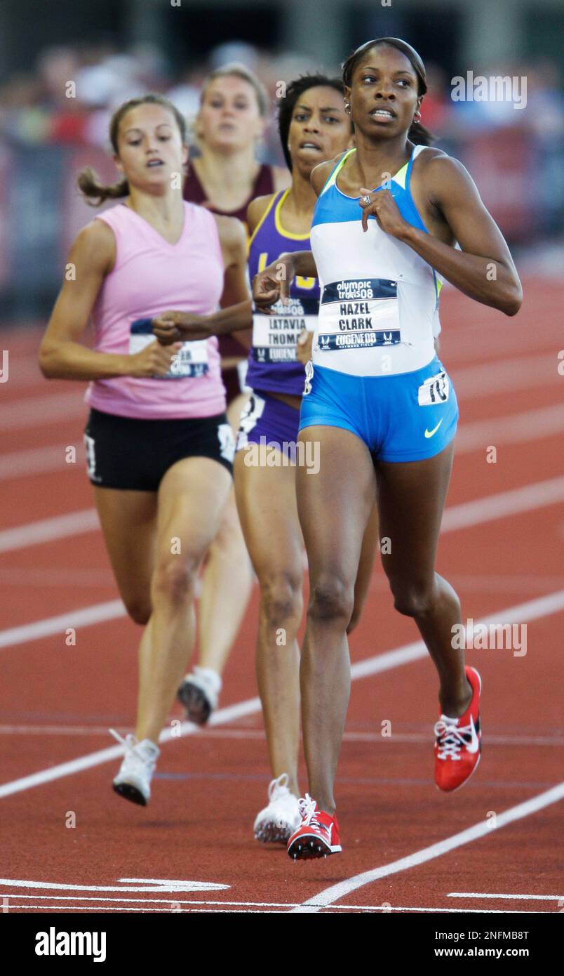 Hazel Clark, right, crosses the finish line during the women's 800 ...