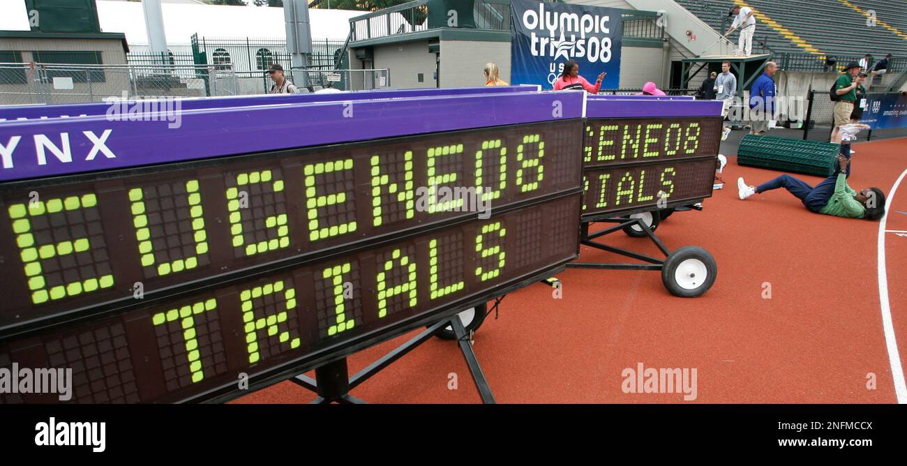 Five-time Olympian Jearl Miles-Clark, far right, stretches before her ...