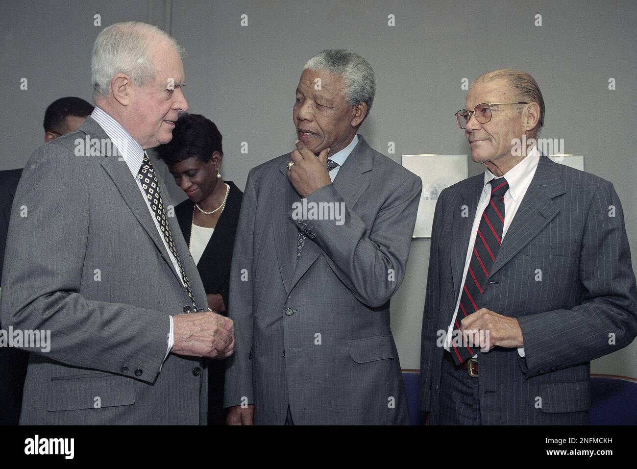African National Congress President Nelson Mandela, center, chats with Cyrus Vance, left, and ...