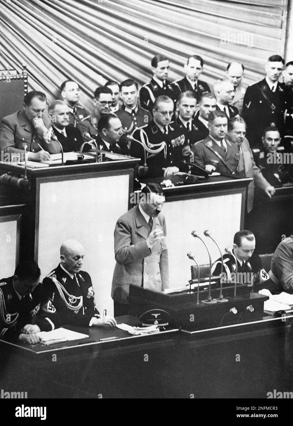Adolf Hitler is shown on the speaker's rostrum at the Reichstag in ...
