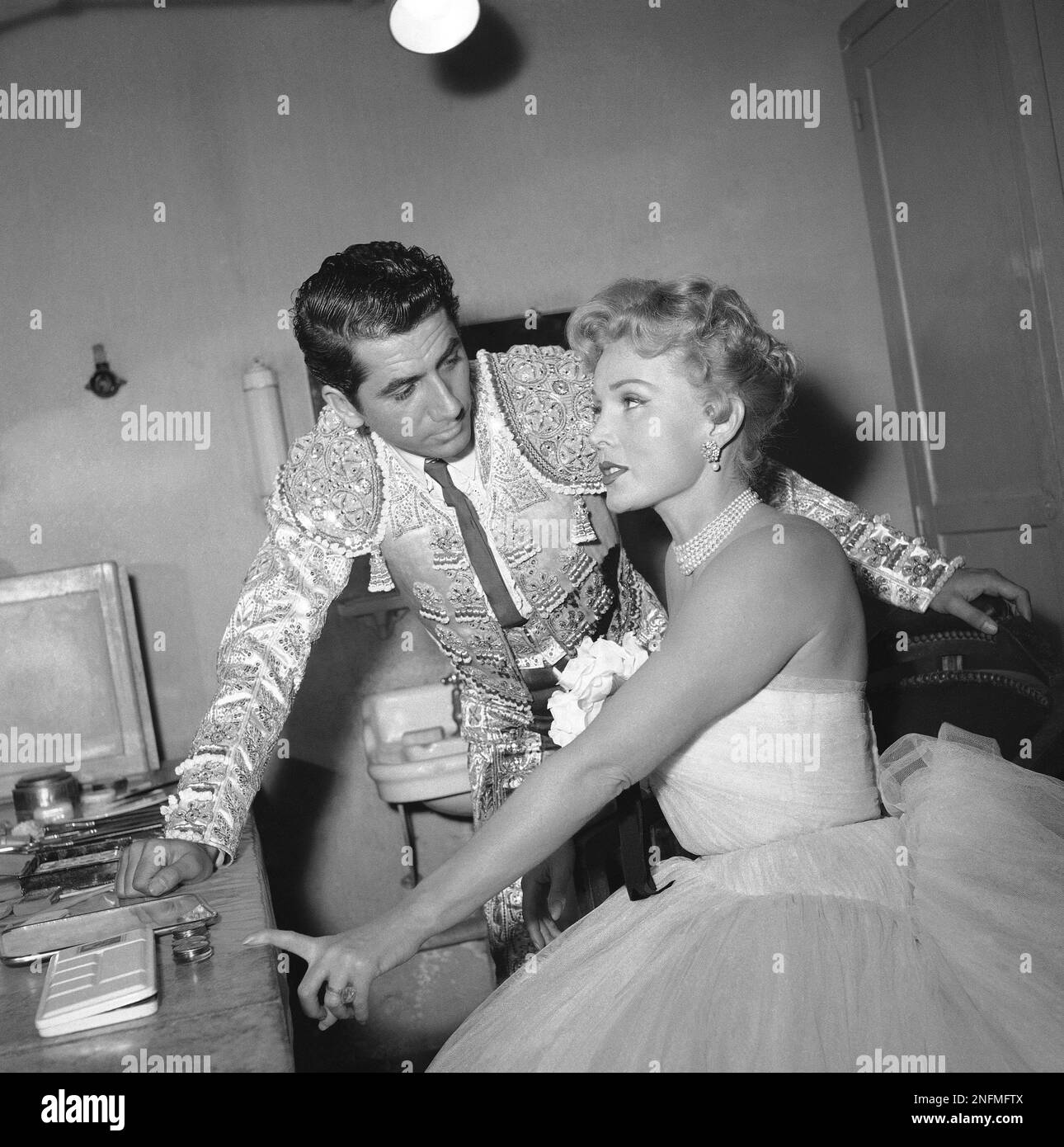 French star Daniel Gelin checks American star Zsa Zsa Gabor's make-up ...
