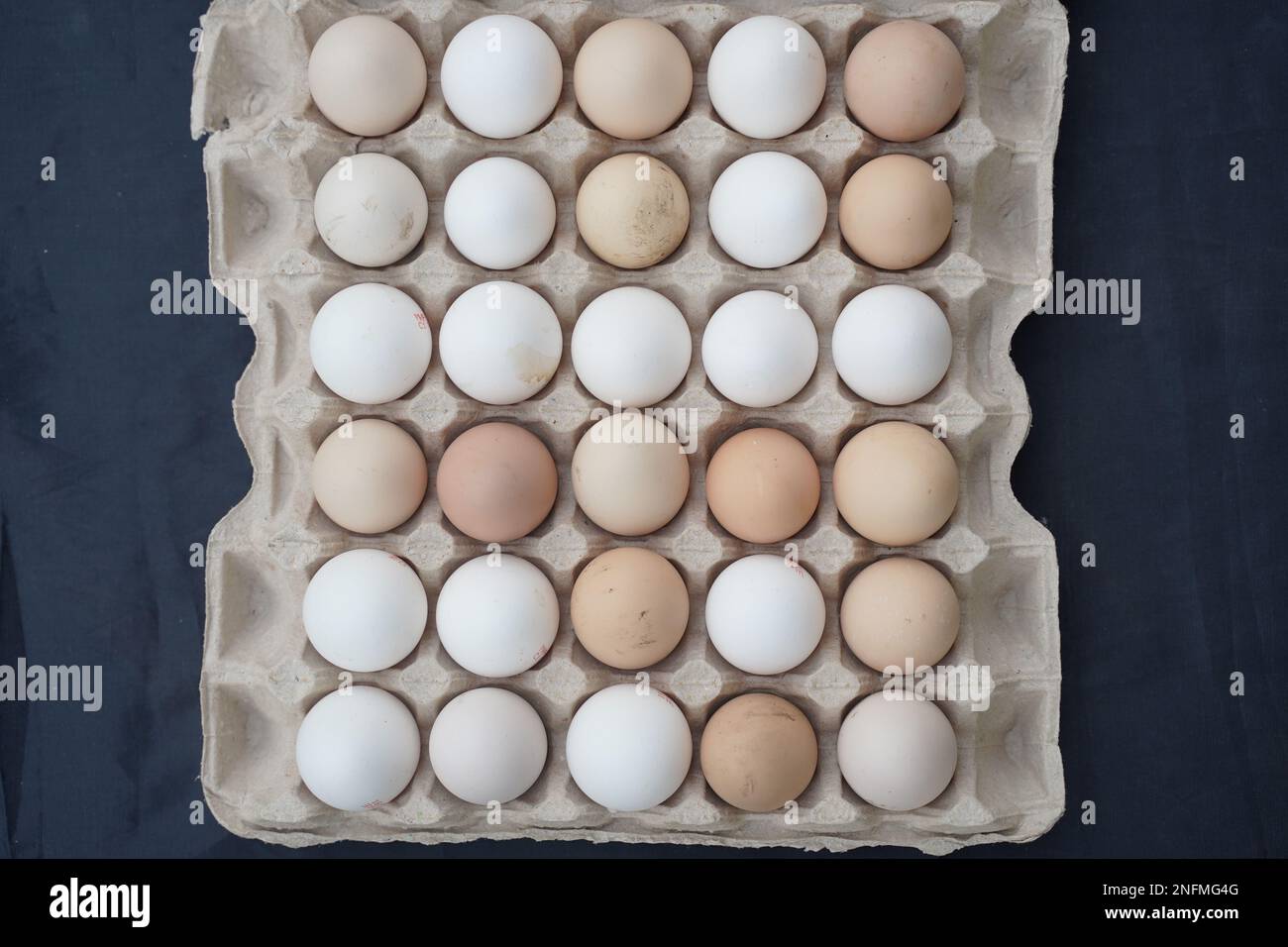 Eggs top view. Packing of fresh chicken eggs on marble background. 30 ...