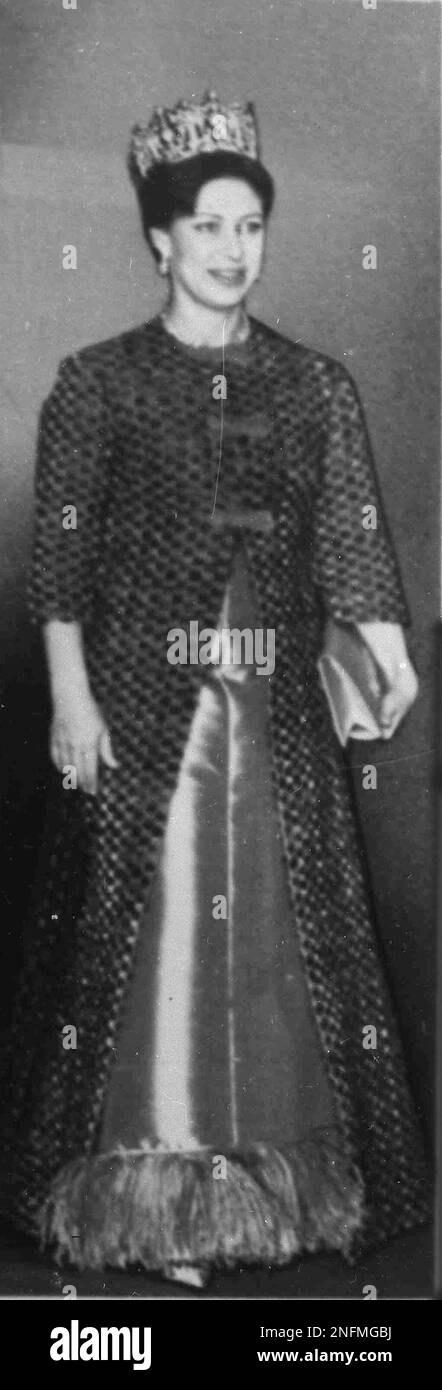 Britain's Princess Margaret, wearing a cornflower blue gown and ...