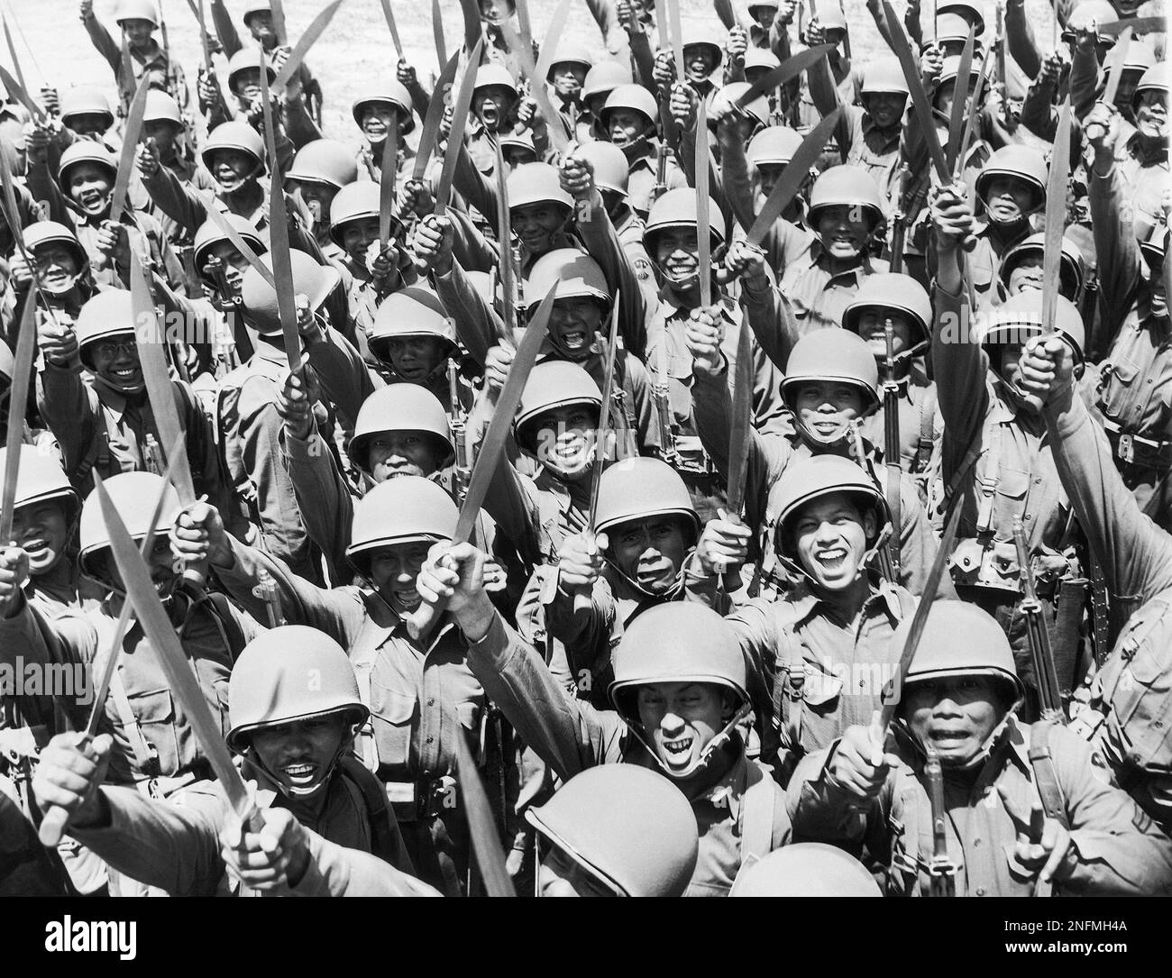 Filipino fighters are getting into sharp training on July 24, 1943 ...