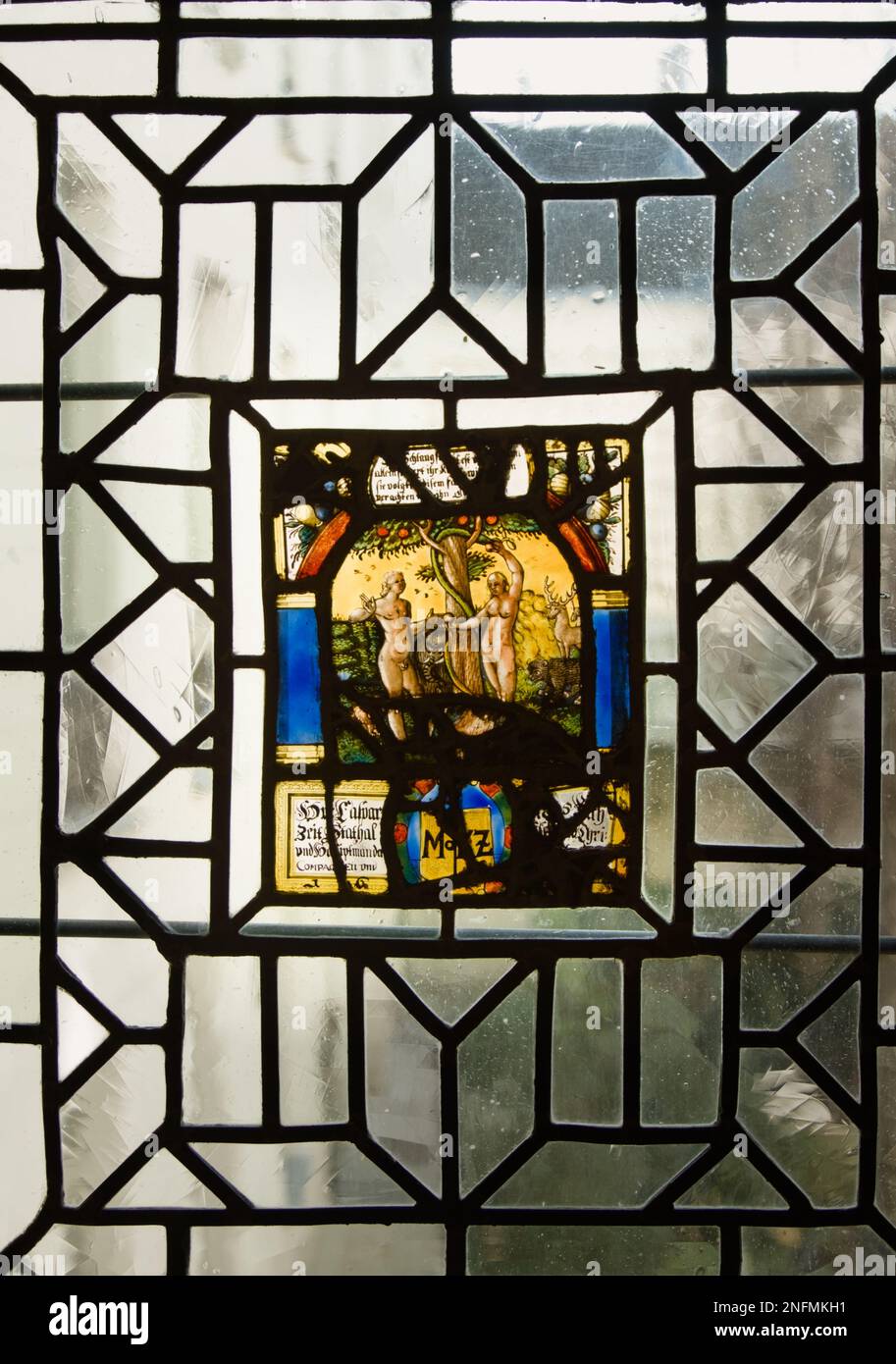 Detail Of A Stained Glass Window Telling The Story Of Adam And Eve In ...