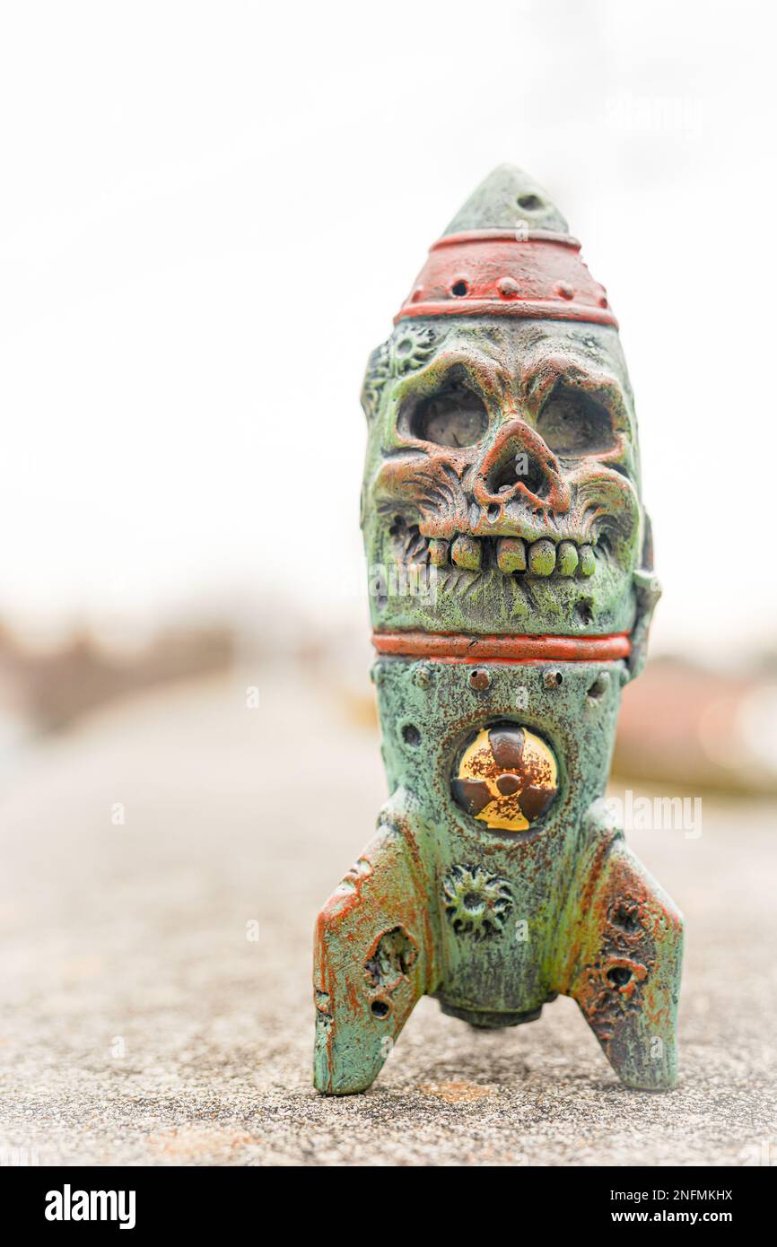 a nuclear atomic bomb statue with a skeleton face with a radiation ...