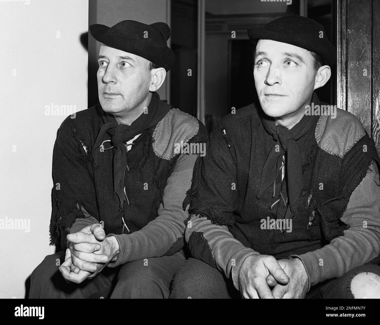 Bing Crosby and his stand-in, Allen Calm, take similar poses to show ...