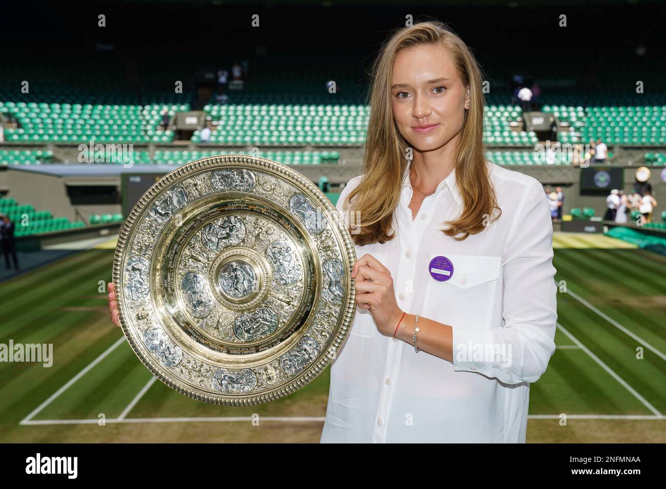 Elena Rybakina poses with her Champions trophy, the Venus Rosewater ...