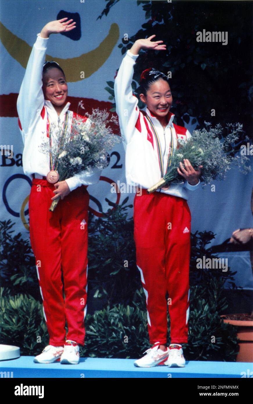 Japan's synchronized swimming team of Fumiko Okuno, right, and Aki Takayama wave after receiving ...