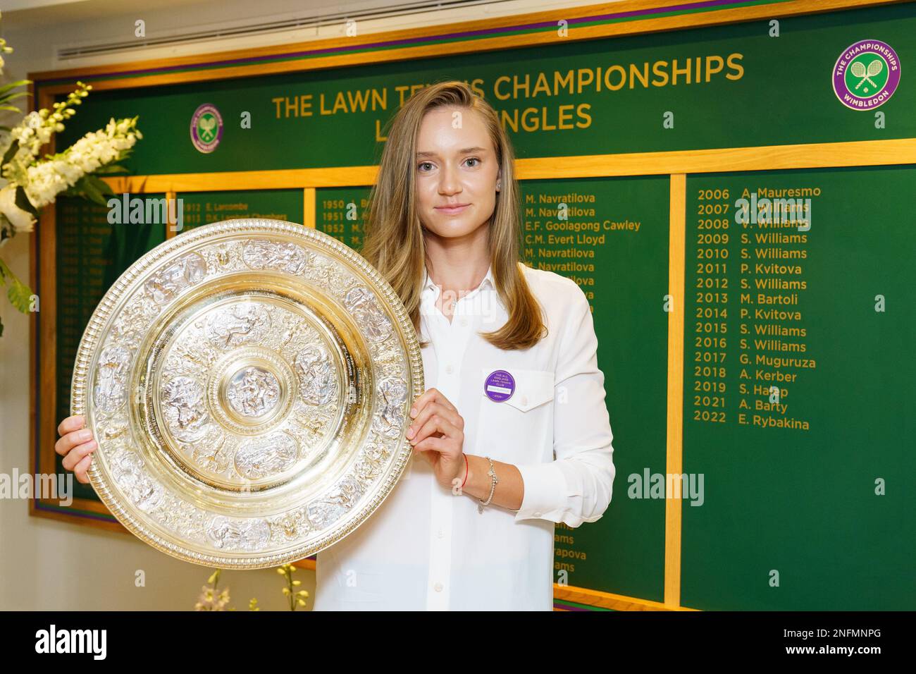 Elena Rybakina poses with her Champions trophy, the Venus Rosewater ...
