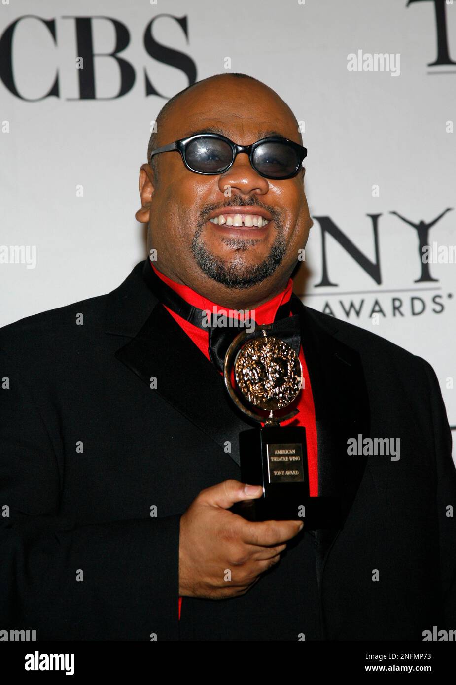 Mark Stewart, also known as Stew, poses backstage with his Tony awards ...