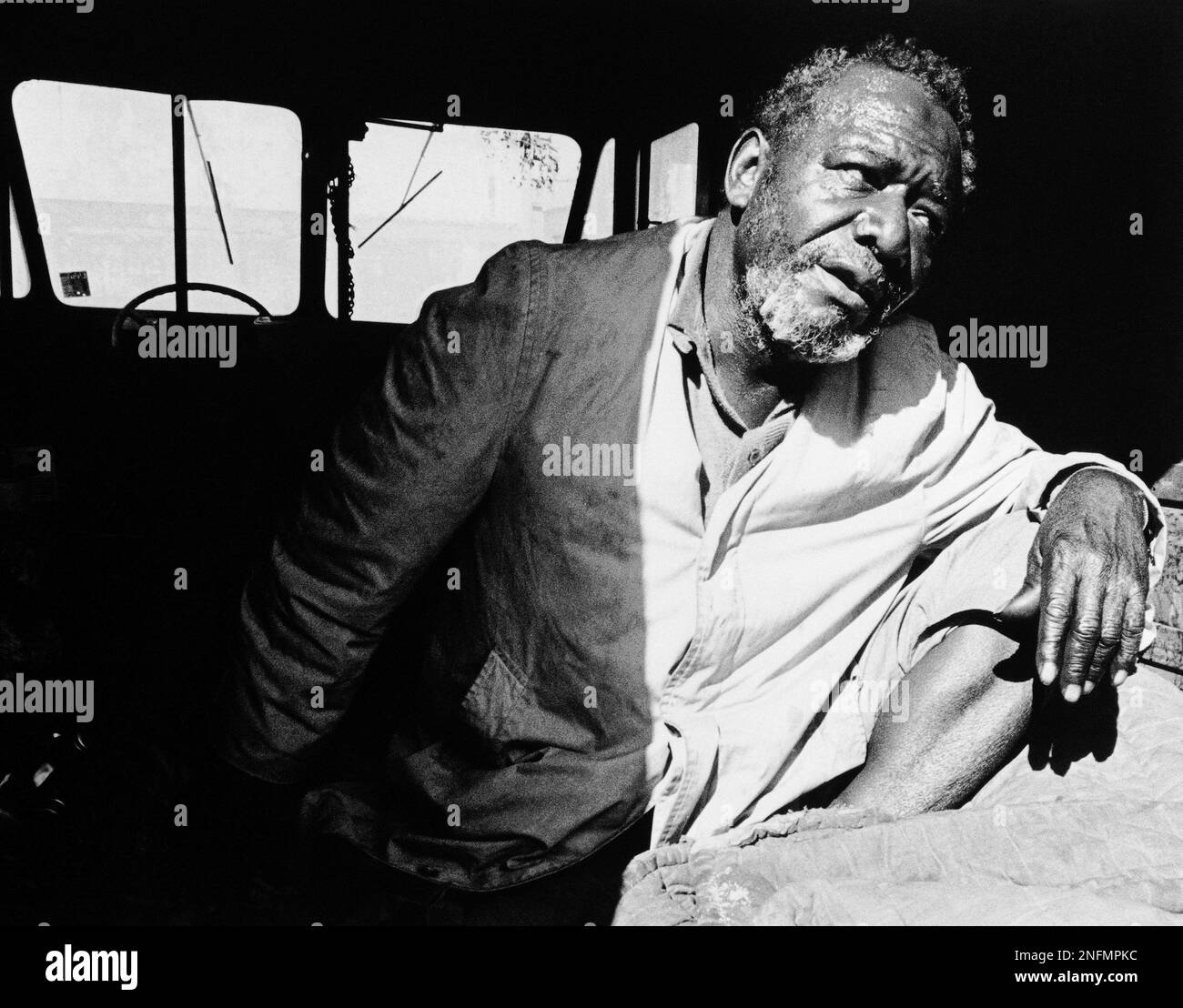 LeRoy Rivers peers from the rear of his panel truck home on July 19 ...