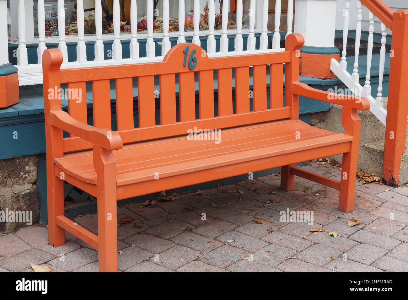An orange bench in front of the porch Stock Photo - Alamy