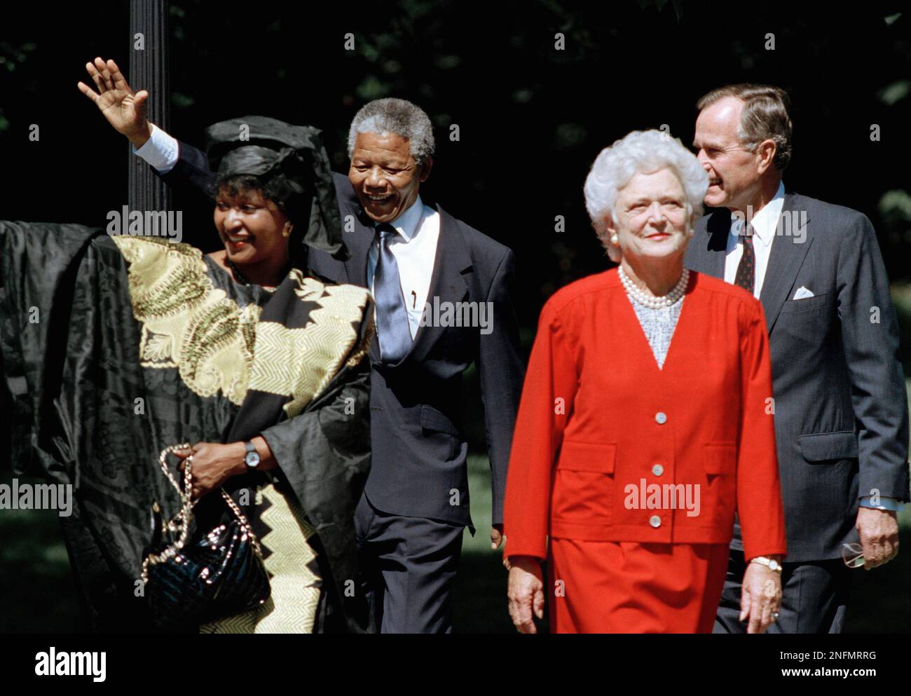 South African leader Nelson Mandela and his wife, Winnie, wave and ...
