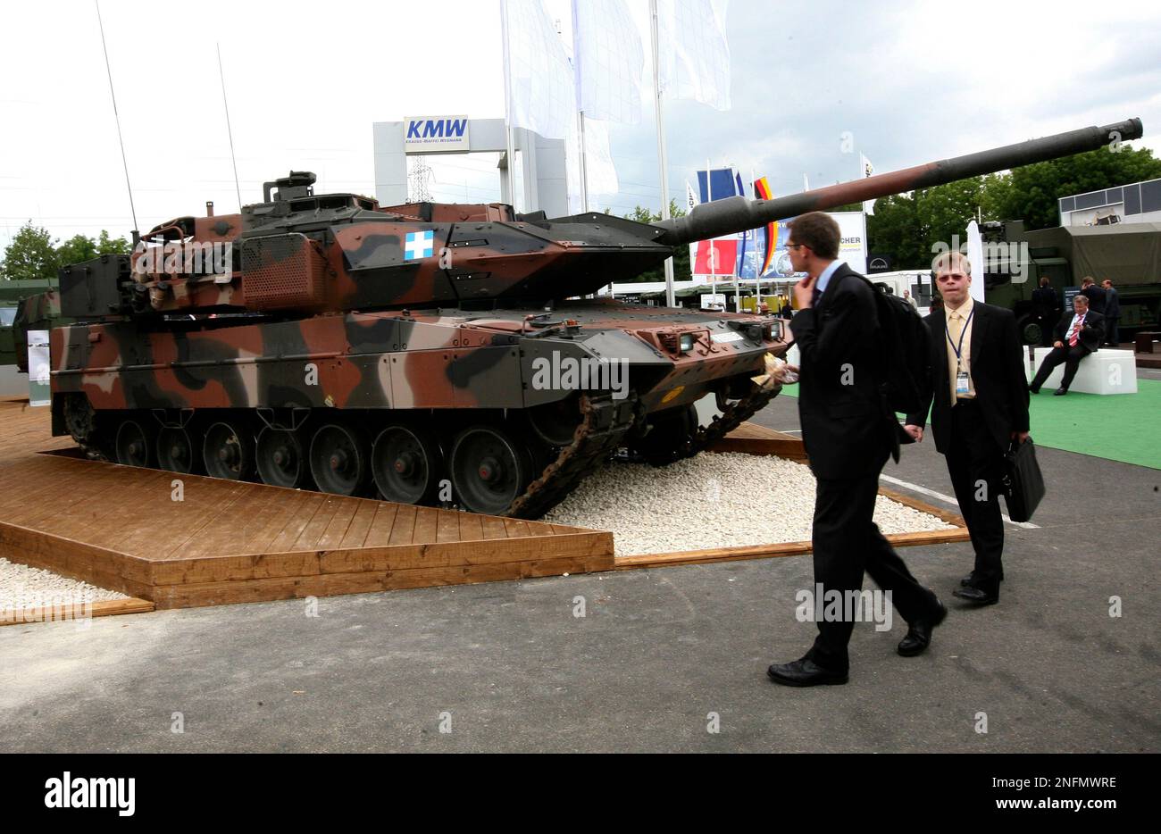 Visitors walk past the German made LEOPARD 2 A6 hel Main Battle tank at ...