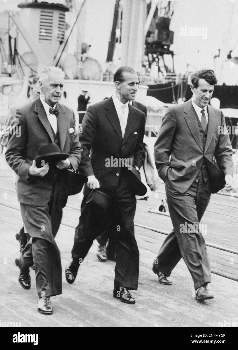 Prince Philip, the Duke of Edinburgh walks along the quayside at ...